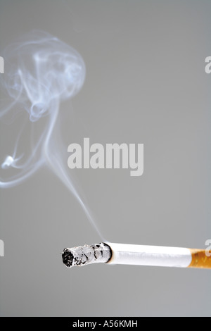Close up of burning cigarettes with smoke and fumes Stock Photo - Alamy