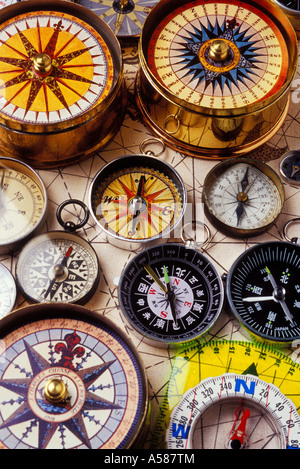Many different compasses on an old map Stock Photo - Alamy