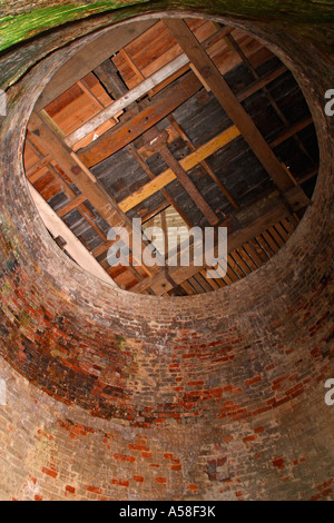 Inside Halnaker Windmill looking up at the iron wheel used to make the ...
