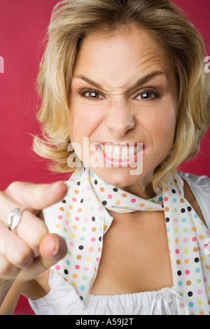 Portrait Of An Angry Young Woman Clenching Her Teeth Stock Photo - Alamy