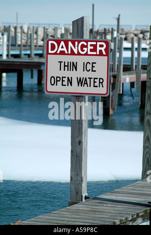 Sign indicating danger thin ice Stock Photo - Alamy