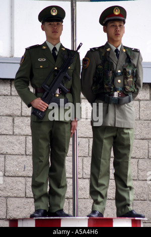 Chinese Military Guards stand watch with an automatic assault rifle ...