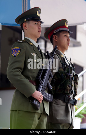 Chinese Military Guards stand watch with an automatic assault rifle ...