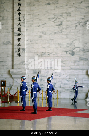 TAIPEI, TAIWAN: Ceremonial guards with rifle and bayonet with tourist in the background at ...