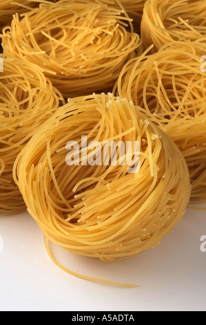 dried pasta on a white background Stock Photo - Alamy