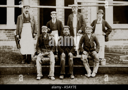 Historic archive image of men outside butcher's shop with hanging meat ...