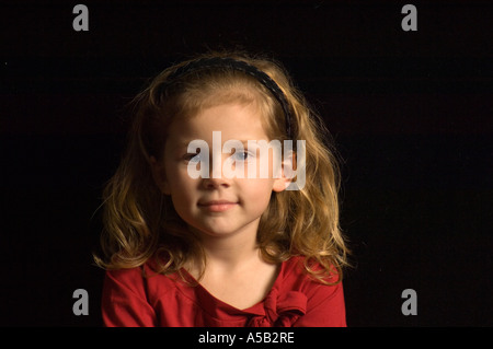 Five year old posing with pleasent look on her face Stock Photo - Alamy
