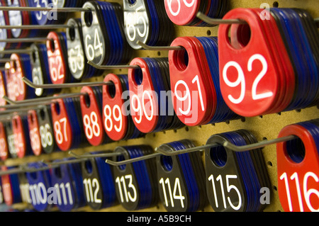 Many numbered plastic tags on a pegboard Stock Photo - Alamy