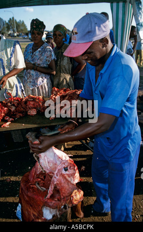 A man chopping meat in a market hall in Athens, Greece Stock Photo - Alamy