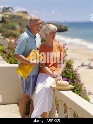 Happy senior couple talking near window and drinking tea Stock Photo ...