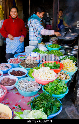 Woman preparing "street food," Menghai, Xishuangbanna, China Stock ...