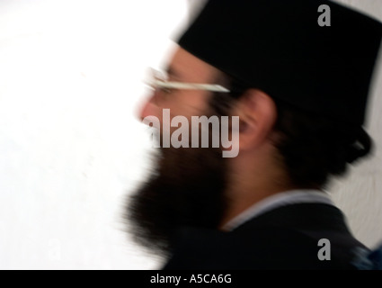 Portrait Black dressed Greek Orthodox clergyman wearing hat beard stick ...