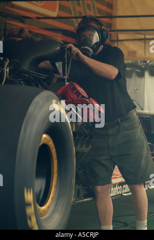 Mechanic wearing gas mask in garage Stock Photo - Alamy