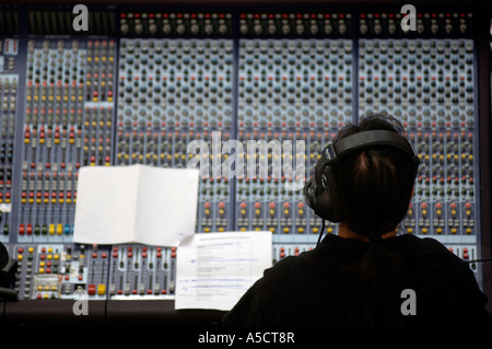 A sound technician adjusts a sound board during a performance Stock ...