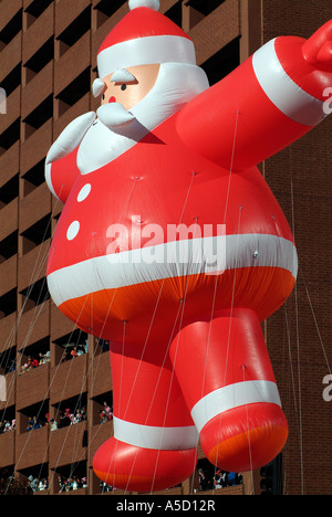 Inflatable santa claus floating in a street Stock Photo - Alamy