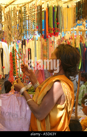 Desia Kondh tribal market stall, man selling sun dried river fish, near ...