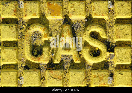 Yellow painted gas manhole on the street Stock Photo - Alamy