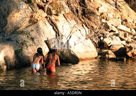Tourists swimming in the Merced River in Yosemite National Park ...