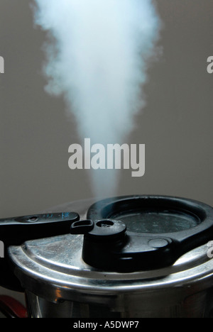 Hot boiling kettle letting out some steam Stock Photo - Alamy