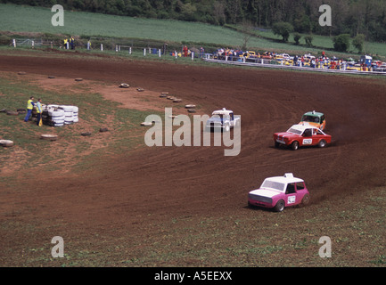 Audience watching racing cars off road racing on a dirt track, wheels ...