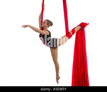 Ballerina Lindsay Roberts dancing with and hanging from a red sash ...
