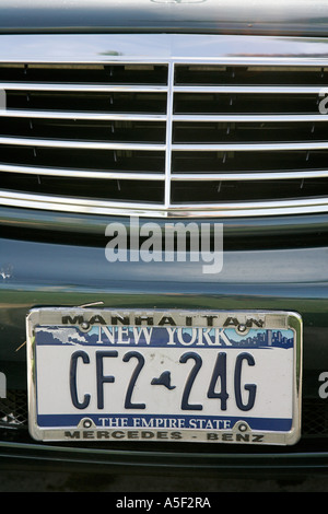 License plate orange white rectangle rectangular blue yellow red curve ...