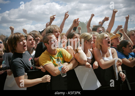 A crowd of saluting fans at an outdoor Summer Music Festival in ...