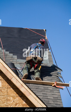 Immigrant Construction Worker Installing Roof Shingles Stock Photo - Alamy
