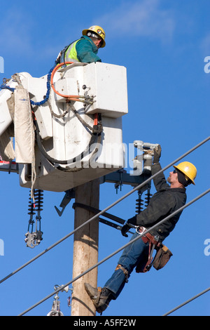 Idaho Power installing electric power lines using cherry pickers near ...