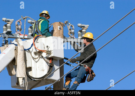 Idaho Power installing electric power lines using cherry pickers near ...