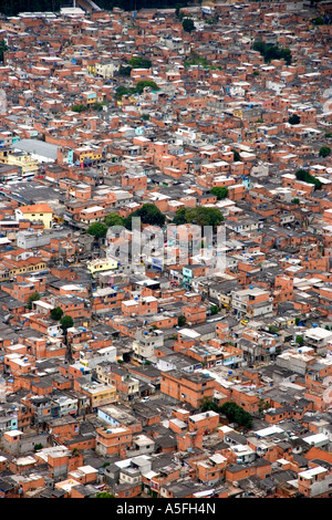 Aerial view of crowded favela housing contrasts with modern apartment ...