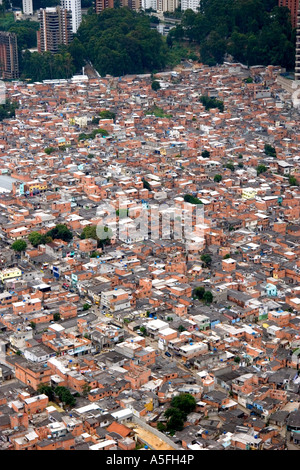 Aerial view of crowded favela housing contrasts with modern apartment ...