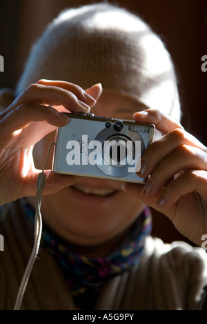 Woman taking picture Stock Photo - Alamy