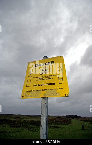 Danger sign near Whitford Point lighthouse on the Gower Peninsular near ...