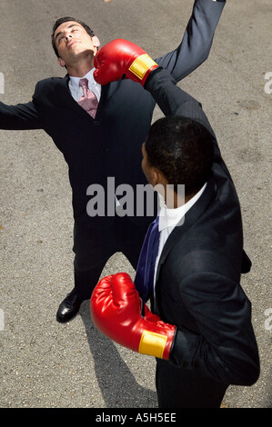 Two businessmen boxing Stock Photo - Alamy