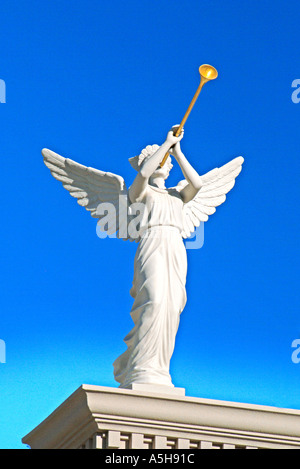 female angel statue blowing trumpet Stock Photo - Alamy