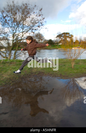 Happy child running and jumping in the park Stock Photo - Alamy