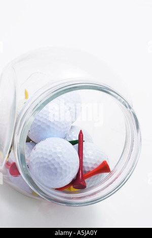 Golf Balls and Tees in Glass Jar Stock Photo - Alamy