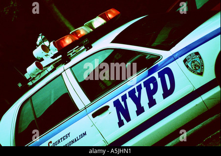 NYPD Police Patrol Car and yellow taxi cabs Manhattan midtown New York ...