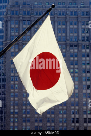 Japanese flag hanging in front of running floodlit track at night Stock ...