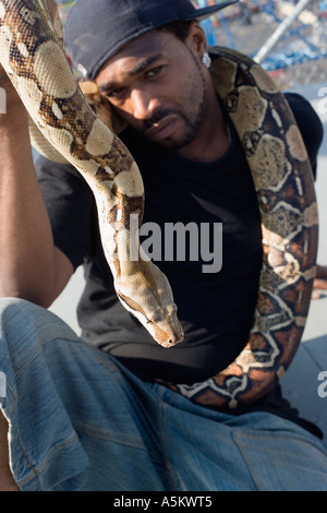 Man with pet python on the boardwalk at Coney Island Stock Photo - Alamy