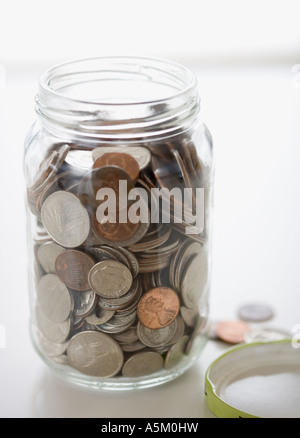 Mason jar with change Stock Photo - Alamy
