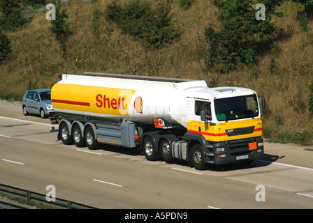 M25 motorway Shell articulated fuel tanker lorry and trailer on incline ...