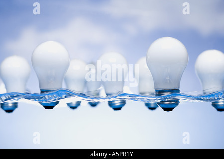 Light bulbs floating in water Stock Photo - Alamy