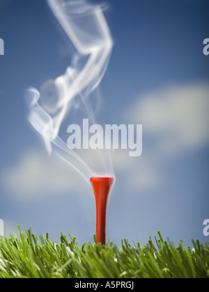 Smoking golf tee Stock Photo - Alamy