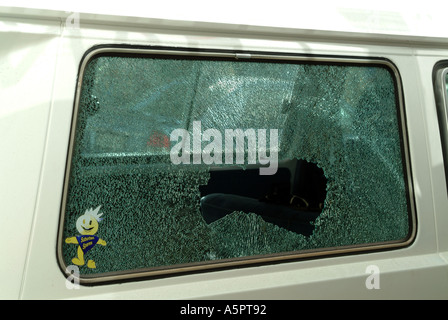 A car with a window broken by 'smash and grab' thieves Stock Photo - Alamy