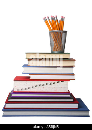 Stack of books and a pencil holder on a table with the words First Day ...