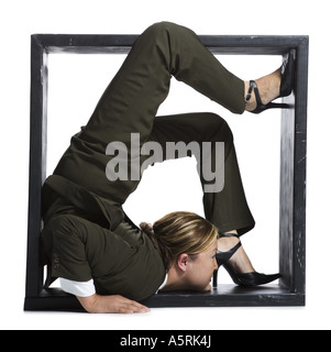 Female contortionist businesswoman inside the box Stock Photo - Alamy
