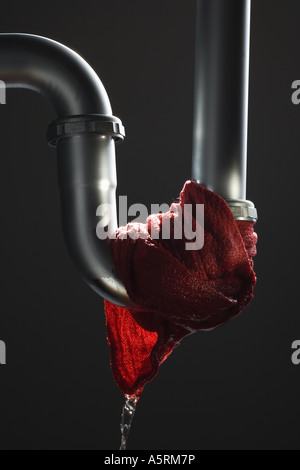 Leaking pipe with dripping rag Stock Photo - Alamy