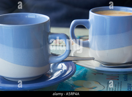 two cups full of coffee on wooden background Stock Photo - Alamy